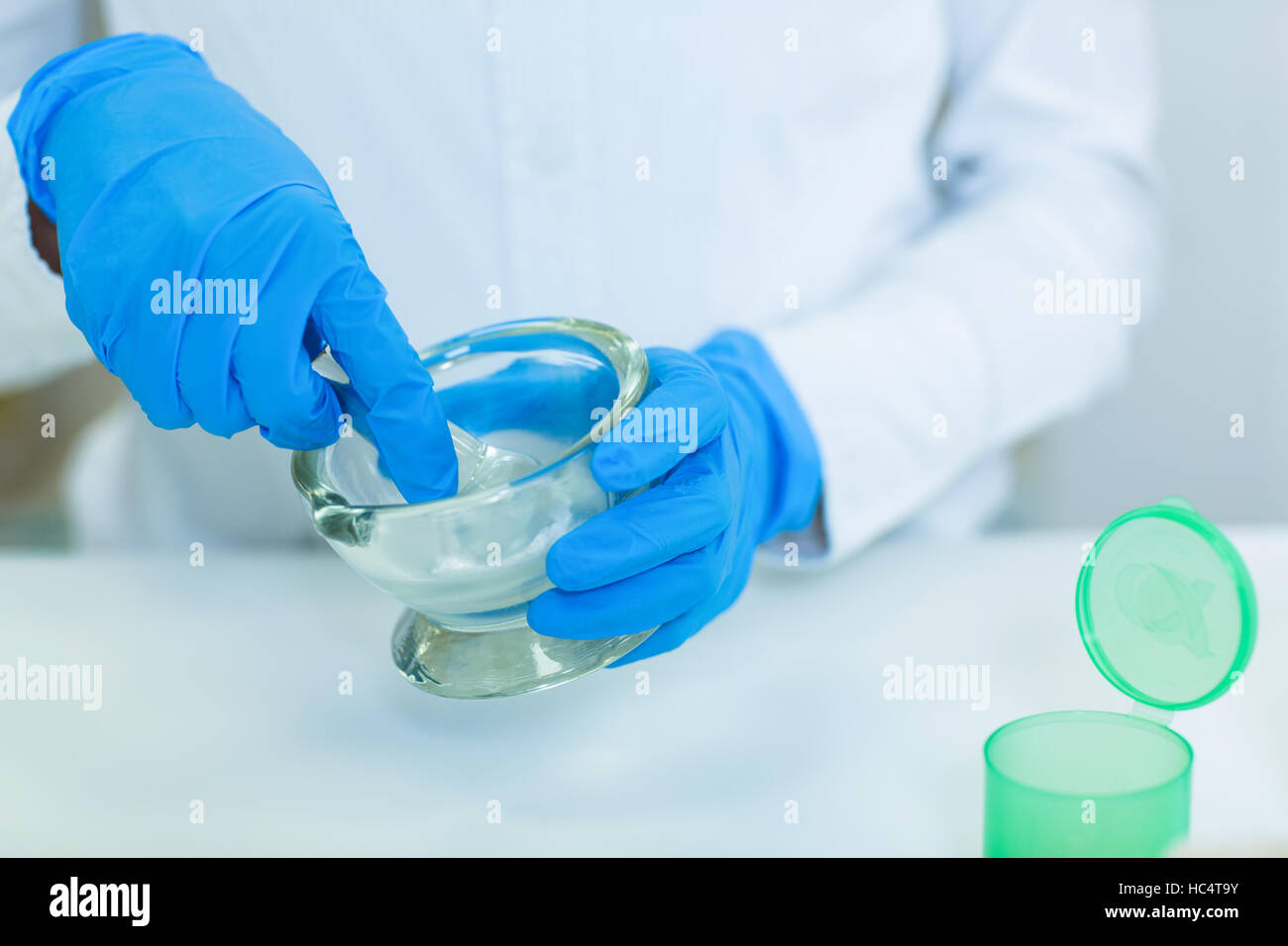 Pharmacist grinding medicine in mortal and pestle Stock Photo - Alamy