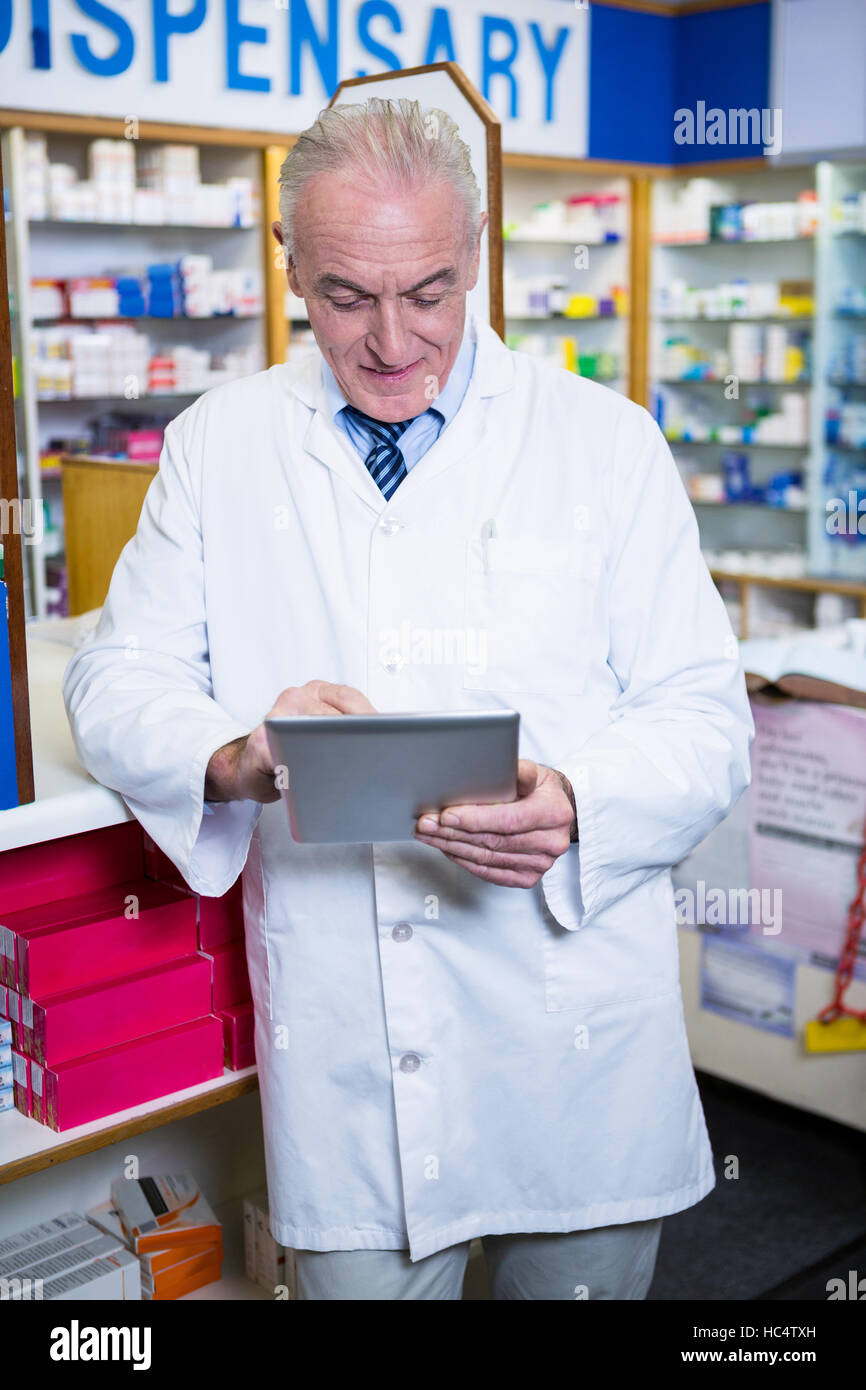 Pharmacist using a digital tablet Stock Photo - Alamy