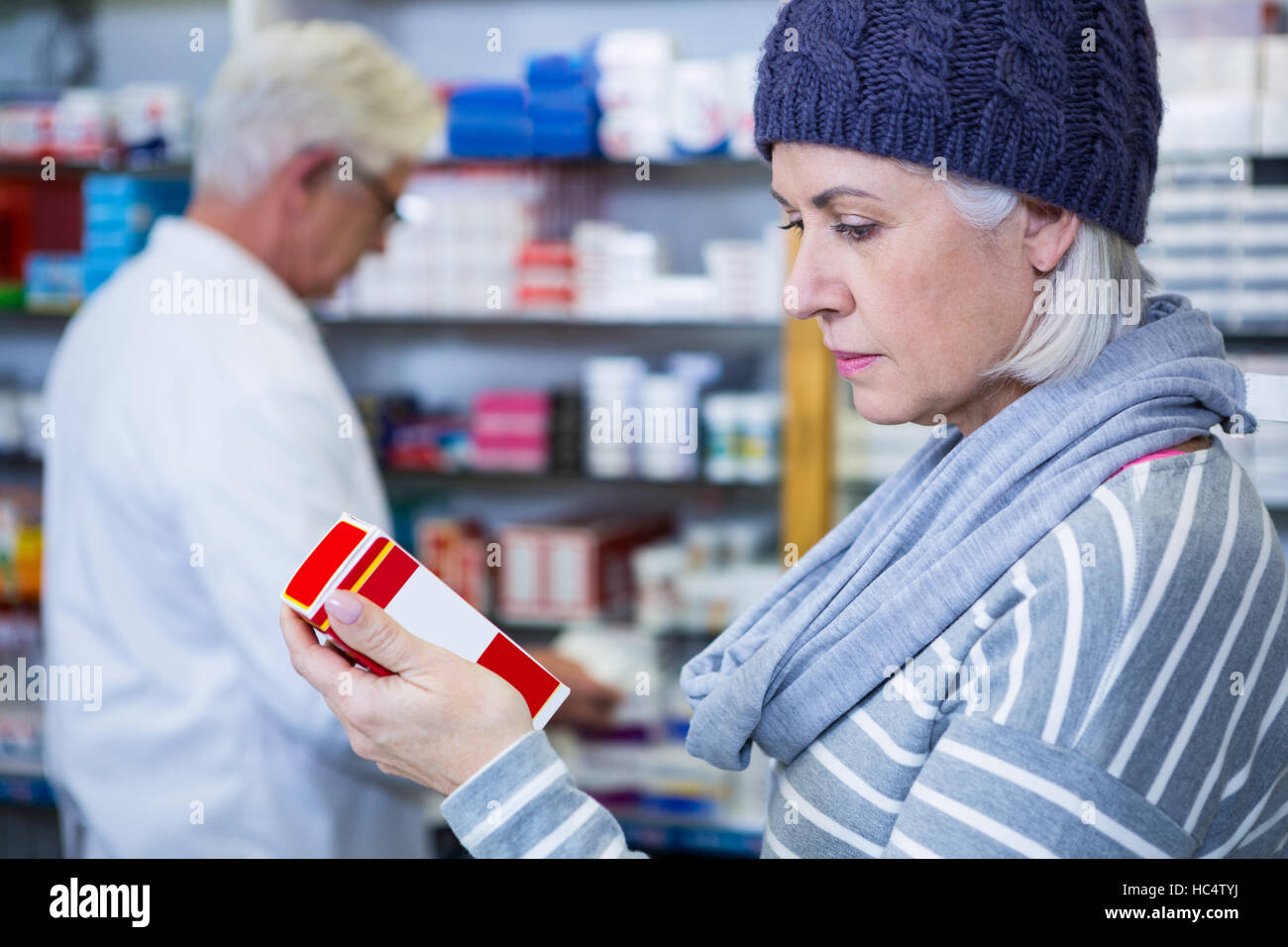 Customer checking a pill box Stock Photo - Alamy