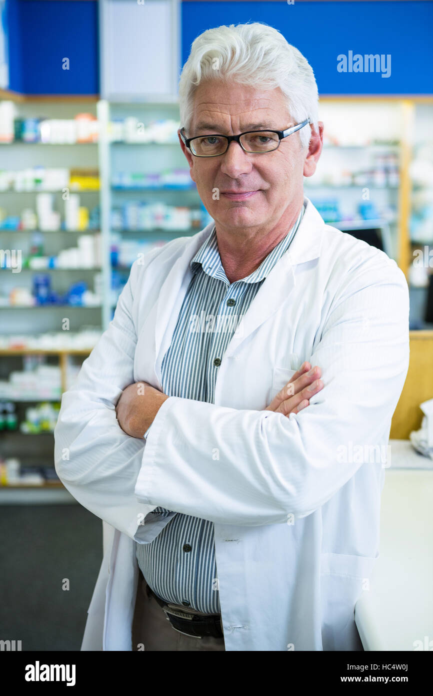 Pharmacist standing with arms crossed Stock Photo - Alamy