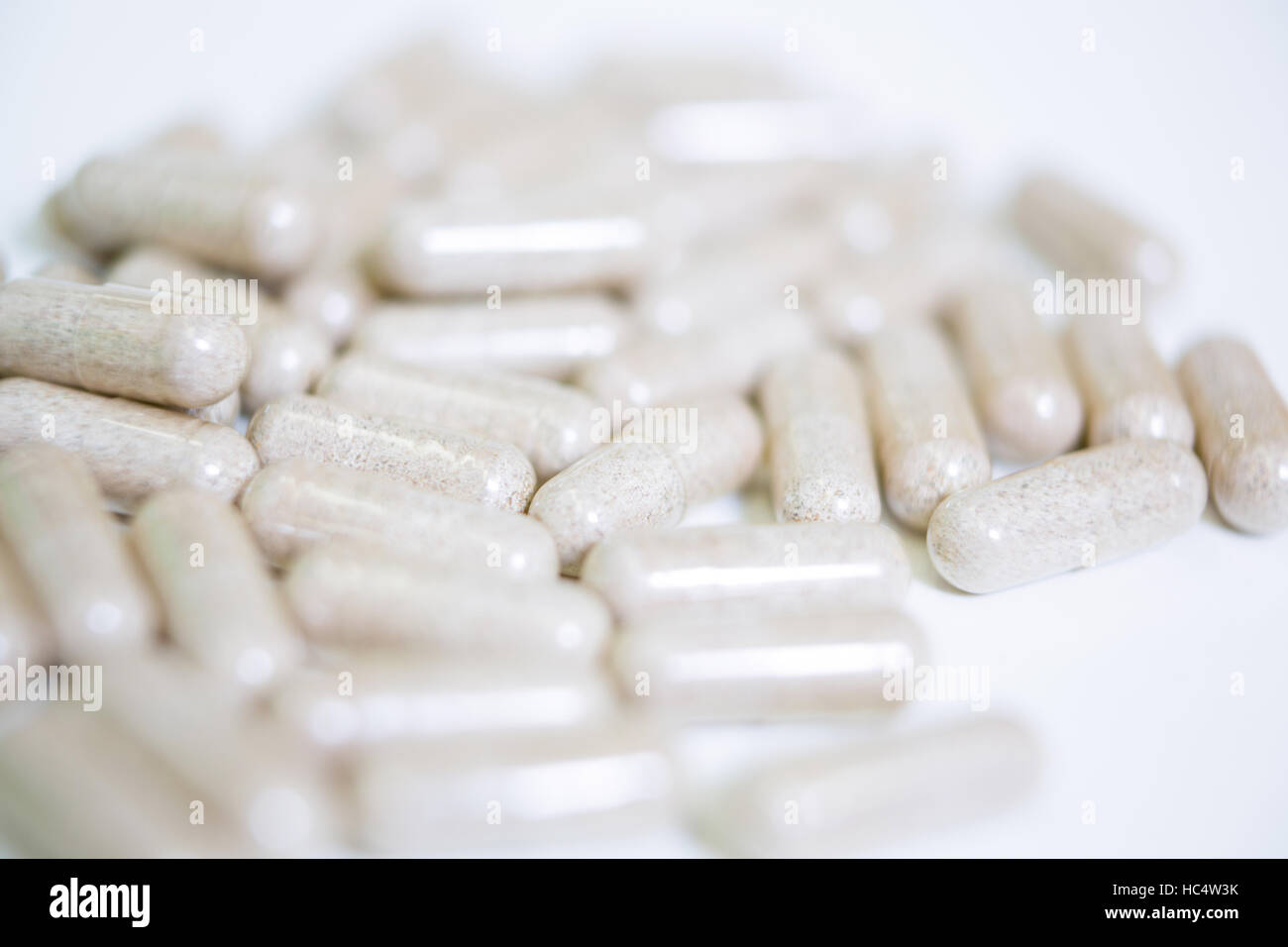 capsules spilled on table Stock Photo - Alamy