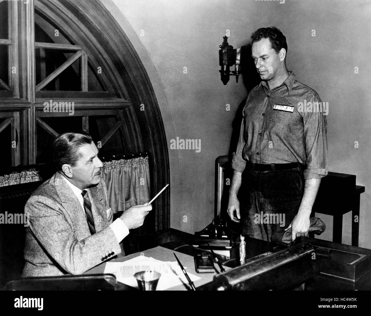 PRISON WARDEN, from left, Warner Baxter, Harlan Warde, 1949 Stock Photo ...