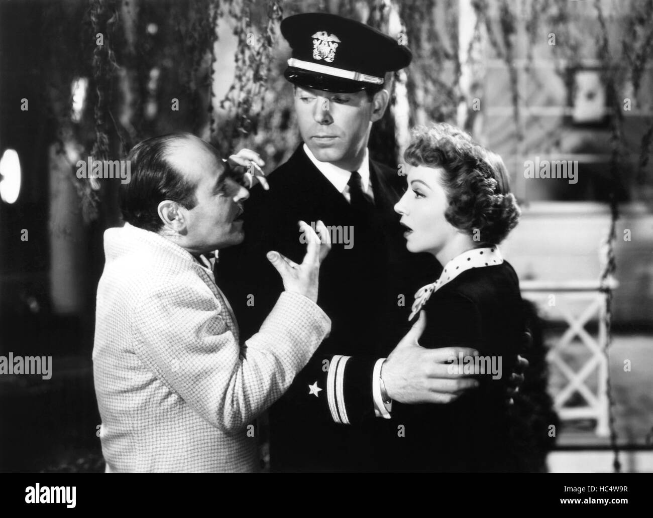 PRACTICALLY YOURS, from left: Mikhail Rasumny, Fred MacMurray ...