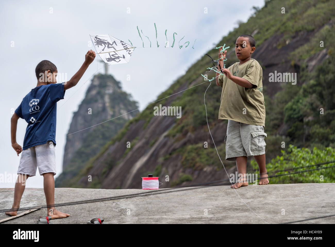 Young Brazilian boys fly a kite in the Favela Santa Marta with the ...