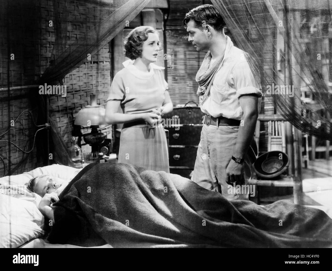 RED DUST, from left, Gene Raymond, (in bed), Mary Astor, Clark Gable ...