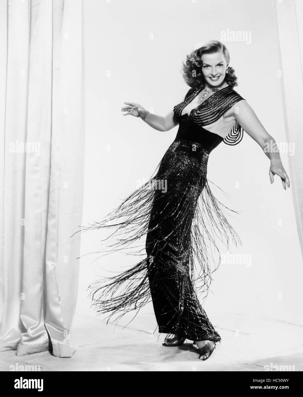 THE REVOLT OF MAMIE STOVER, Jane Russell, in a gown by William Travilla ...