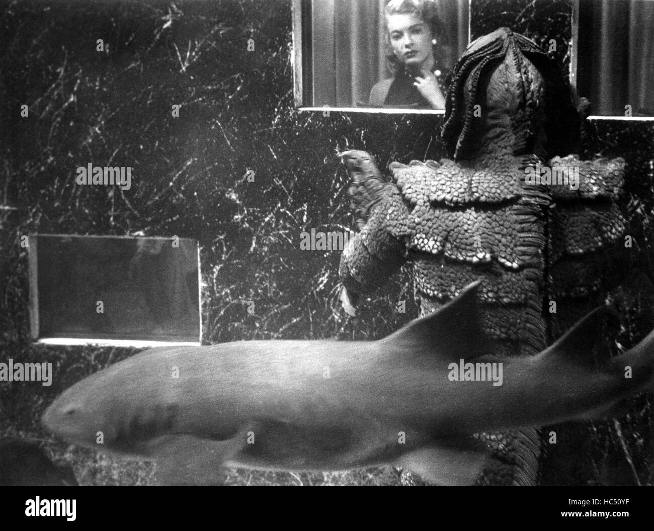 REVENGE OF THE CREATURE (1955) woman looking at Creature in aquarium ...