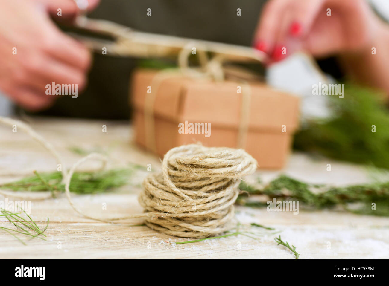 Woman tying knot string hi-res stock photography and images - Alamy