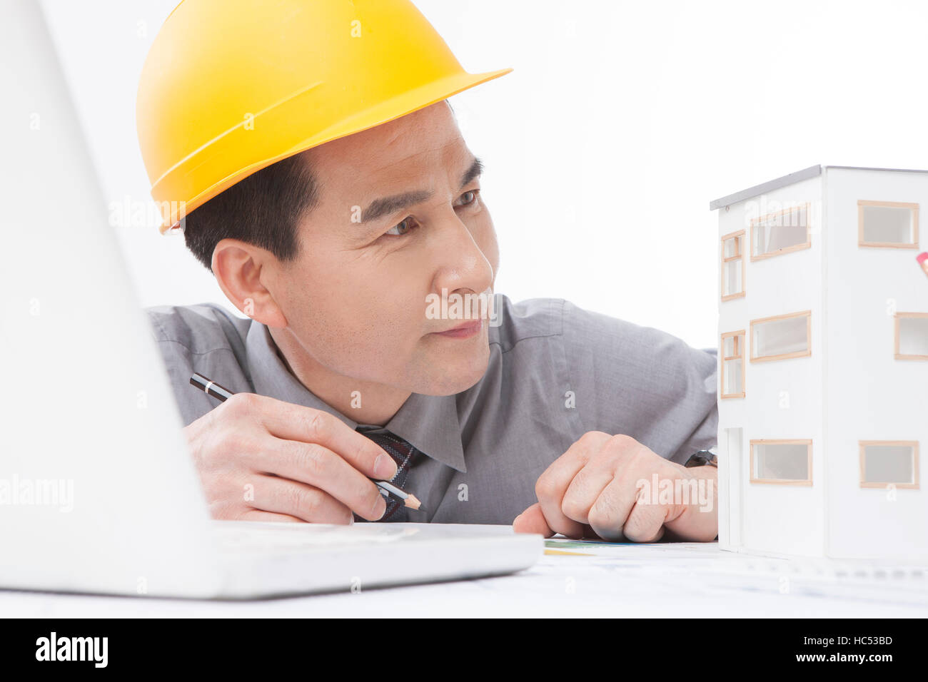 Side view portrait of smiling middle aged architect Stock Photo - Alamy