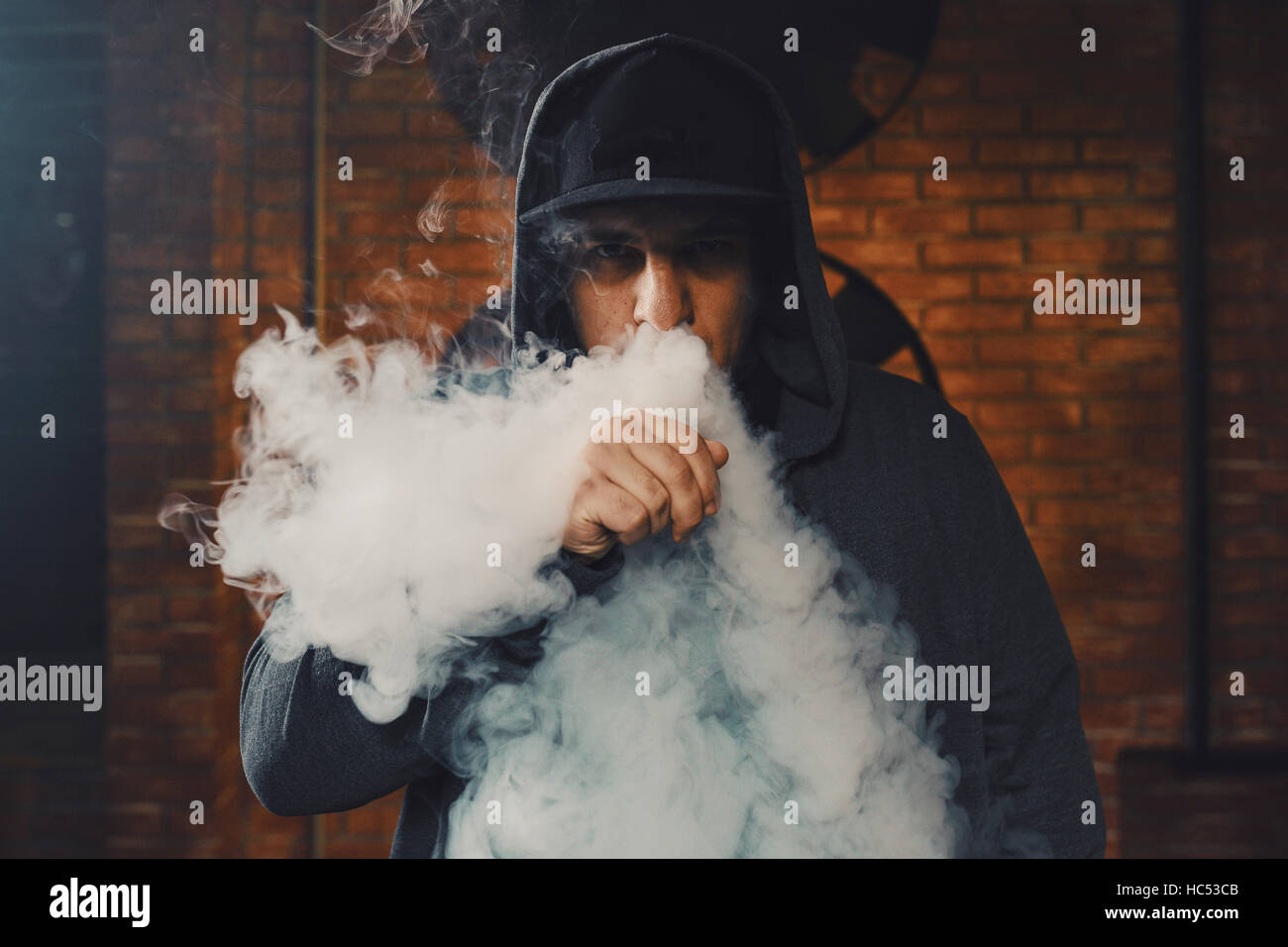 Man vaping an electronic cigarette Stock Photo - Alamy