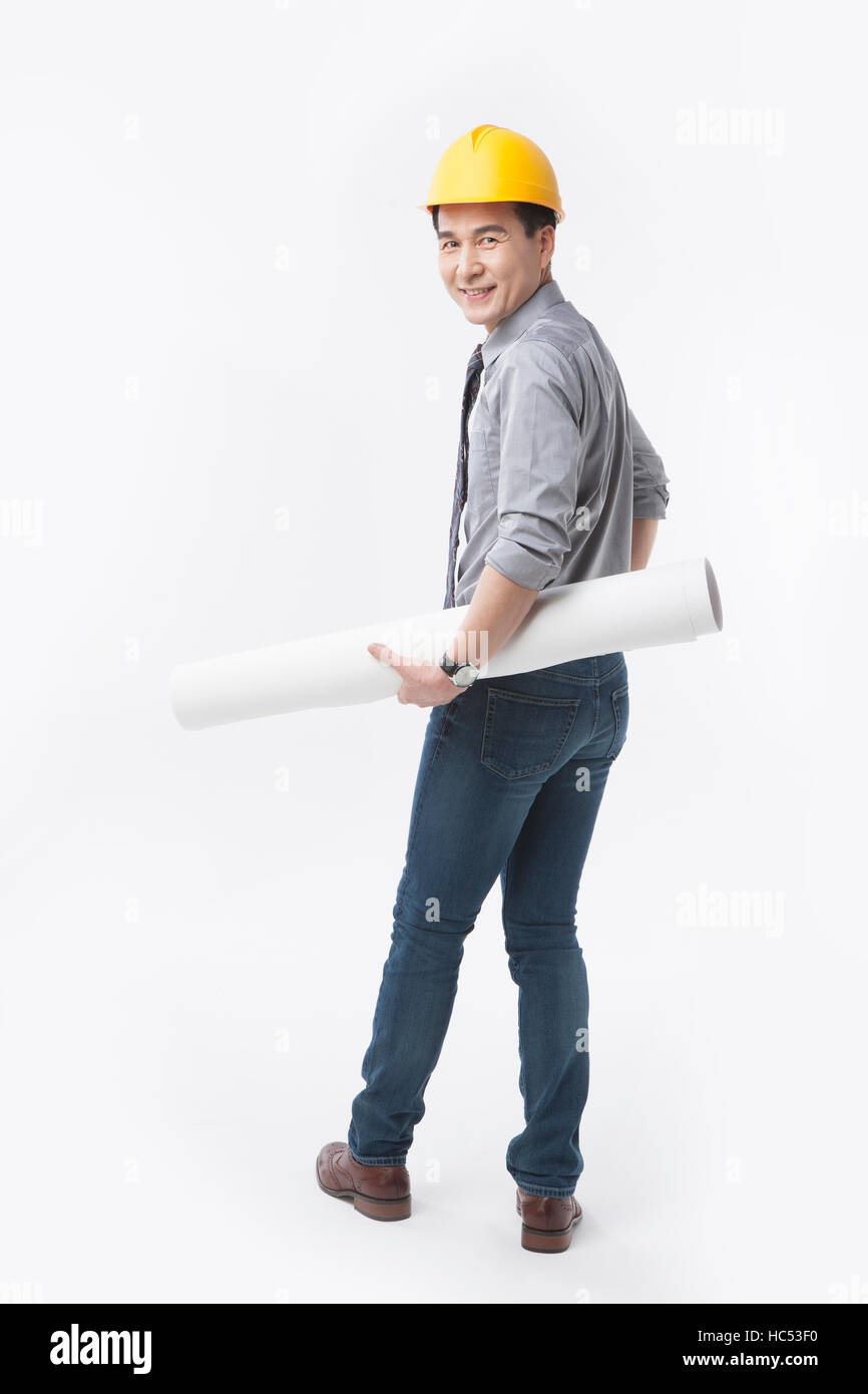 Back of smiling middle aged architect standing looking back Stock Photo ...