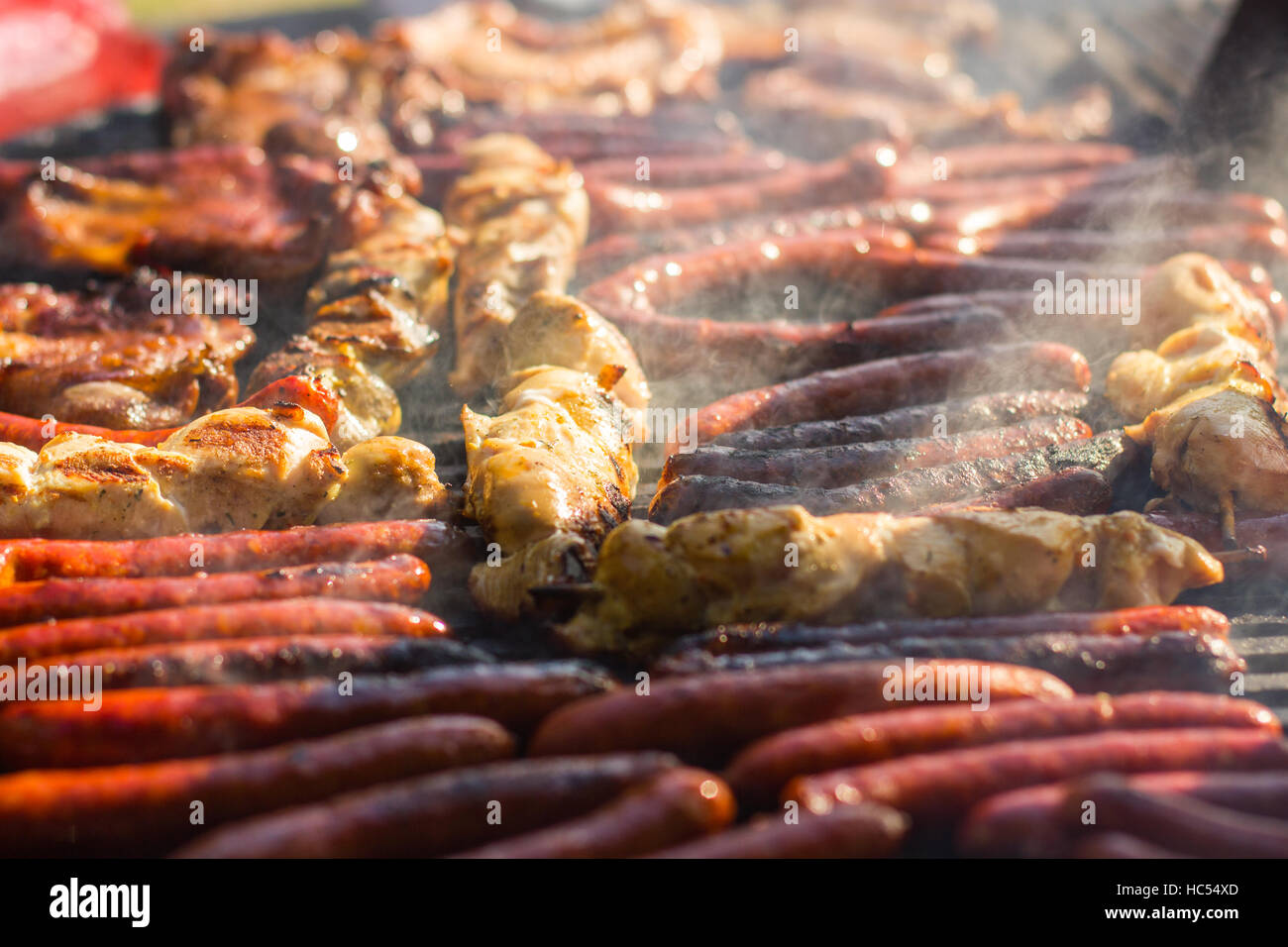 Grilled meat on the barbecue,cooked outdoor Stock Photo - Alamy