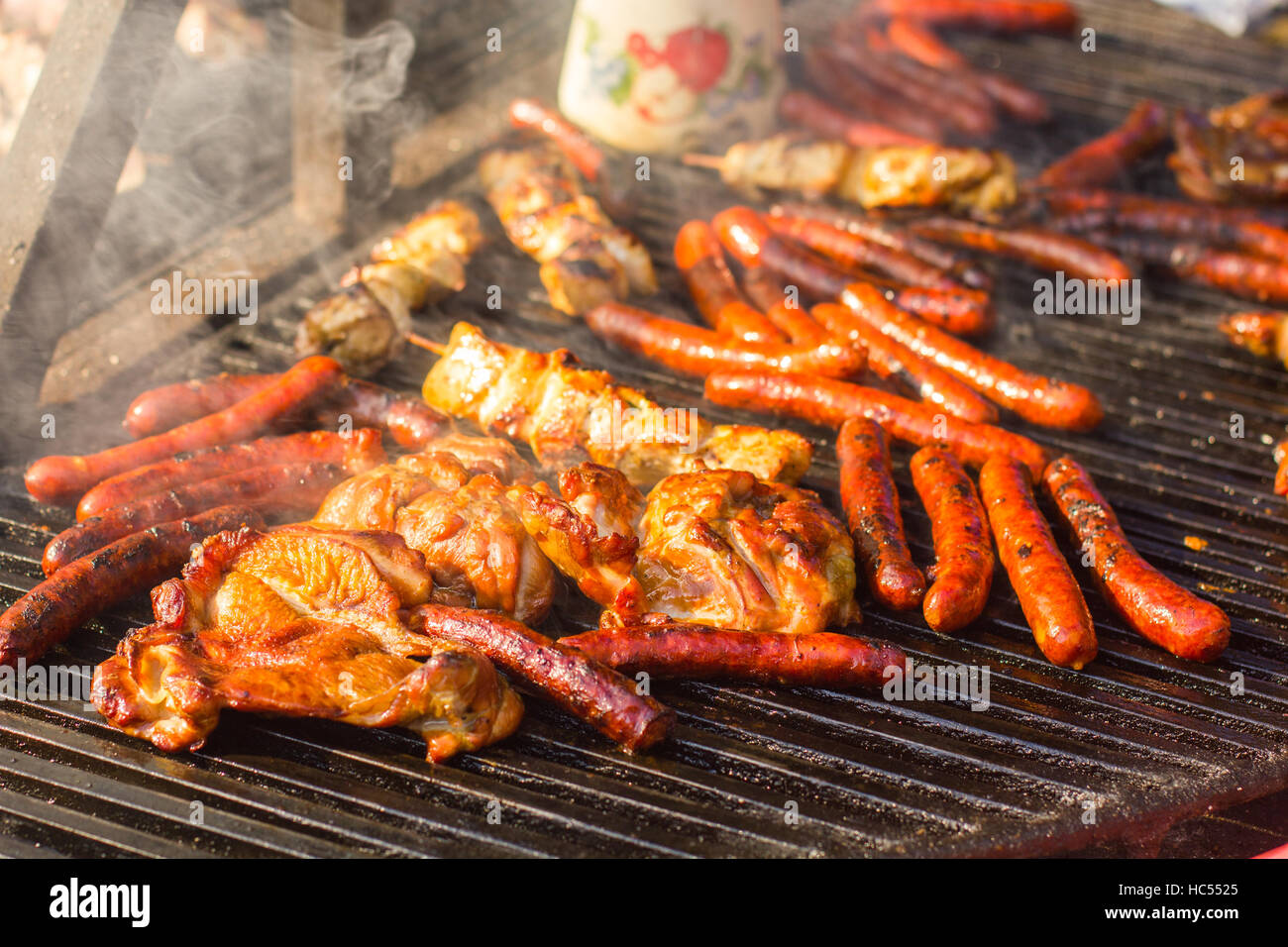 Grilled meat on the barbecue,cooked outdoor Stock Photo - Alamy
