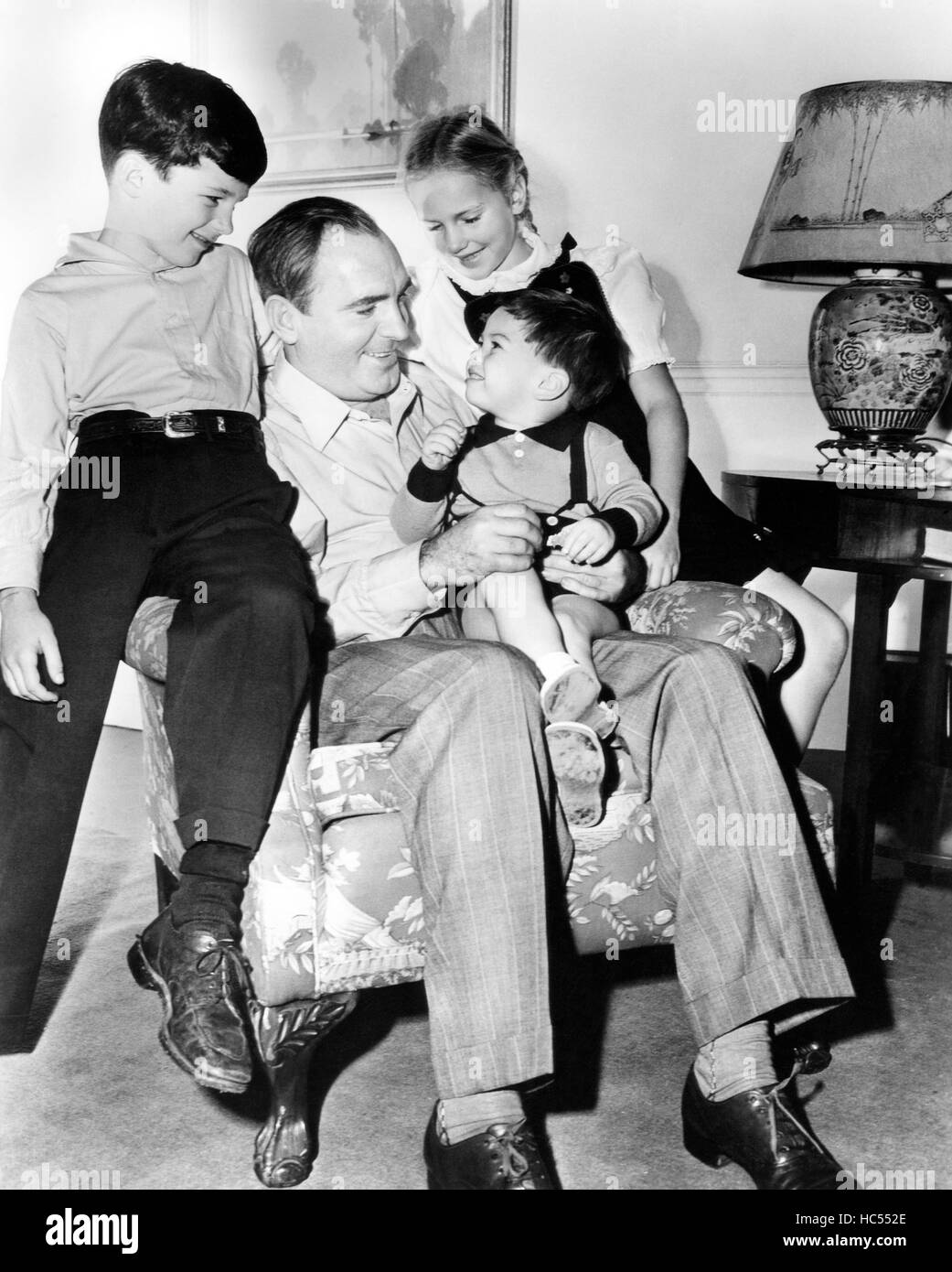 SECRET COMMAND, Pat O'Brien (center) is visted on set by his children ...