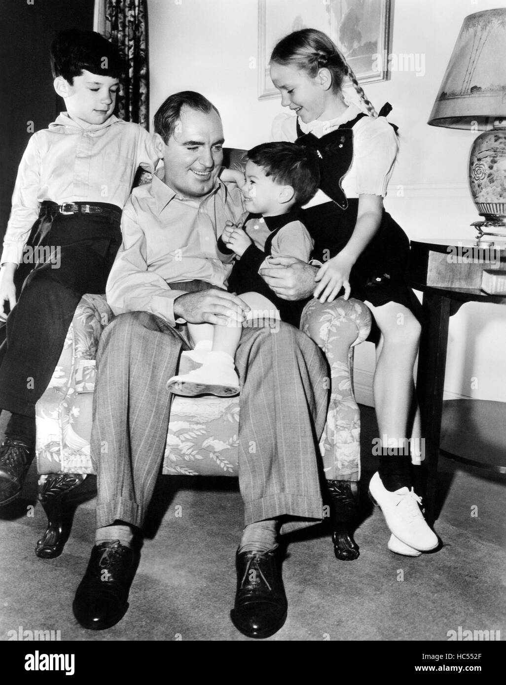 SECRET COMMAND, Pat O'Brien (center) is visted on set by his children ...