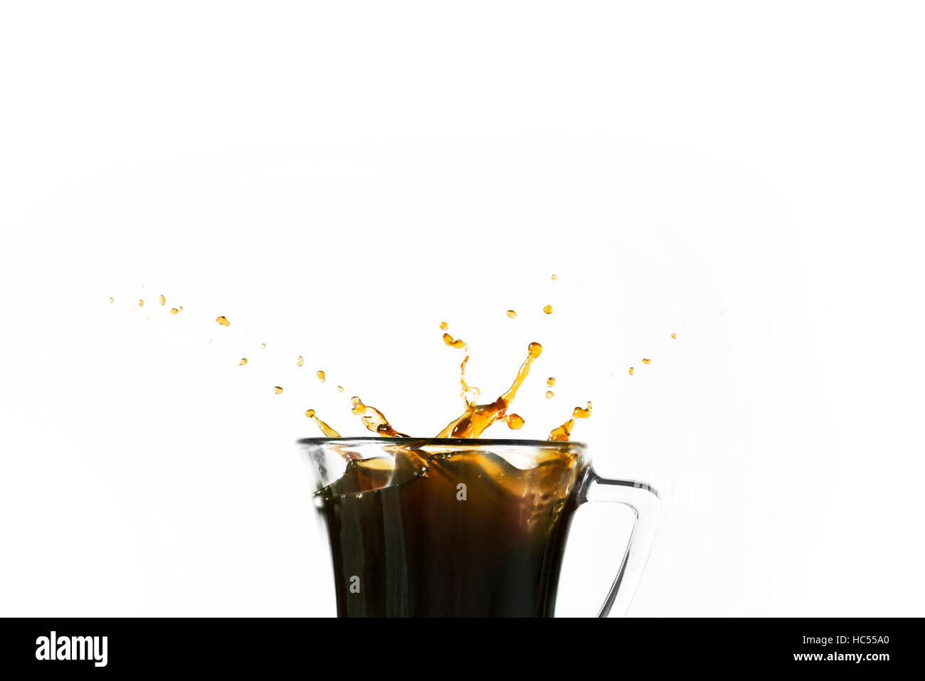 Coffee splash on a white background. High speed photography Stock Photo ...