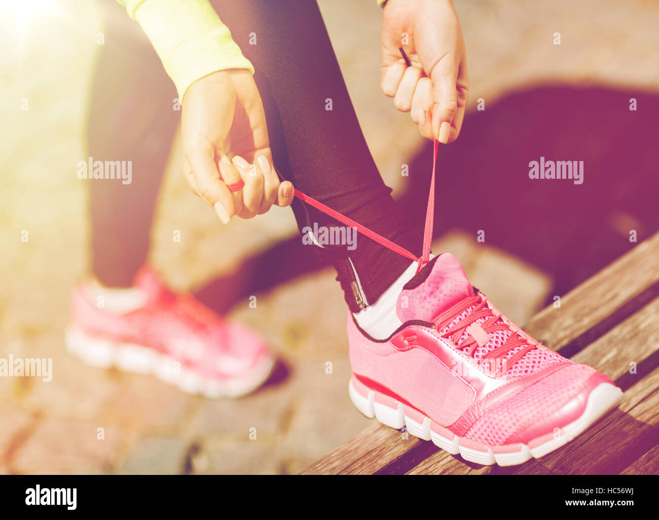 runner woman lacing trainers shoes Stock Photo - Alamy