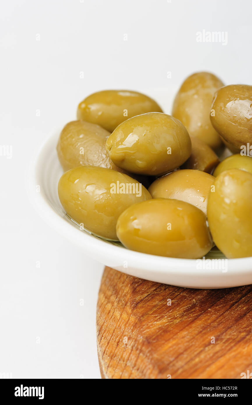 green olives in small dish Stock Photo - Alamy