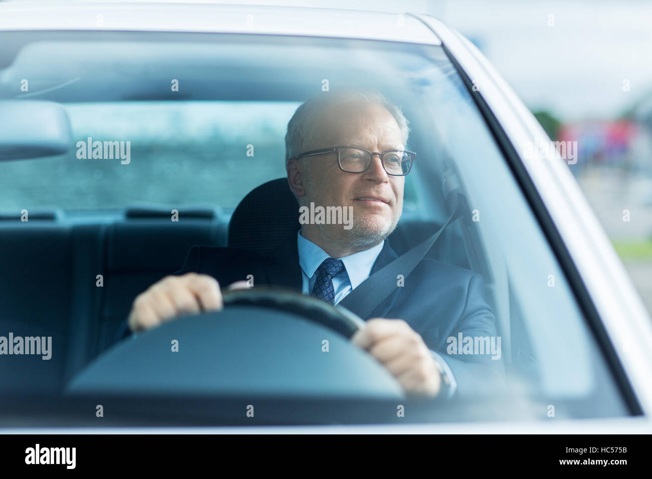 happy senior businessman driving car Stock Photo - Alamy