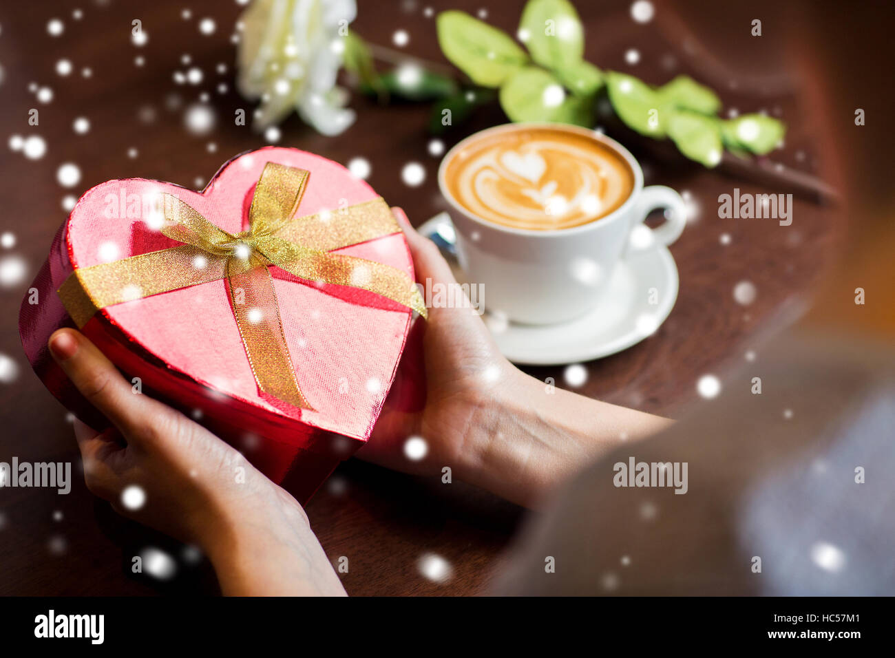hands holding heart shaped gift box Stock Photo - Alamy