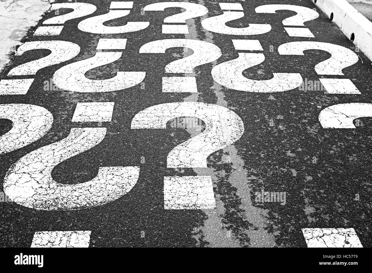 Question marks on urban street, symbol Stock Photo - Alamy