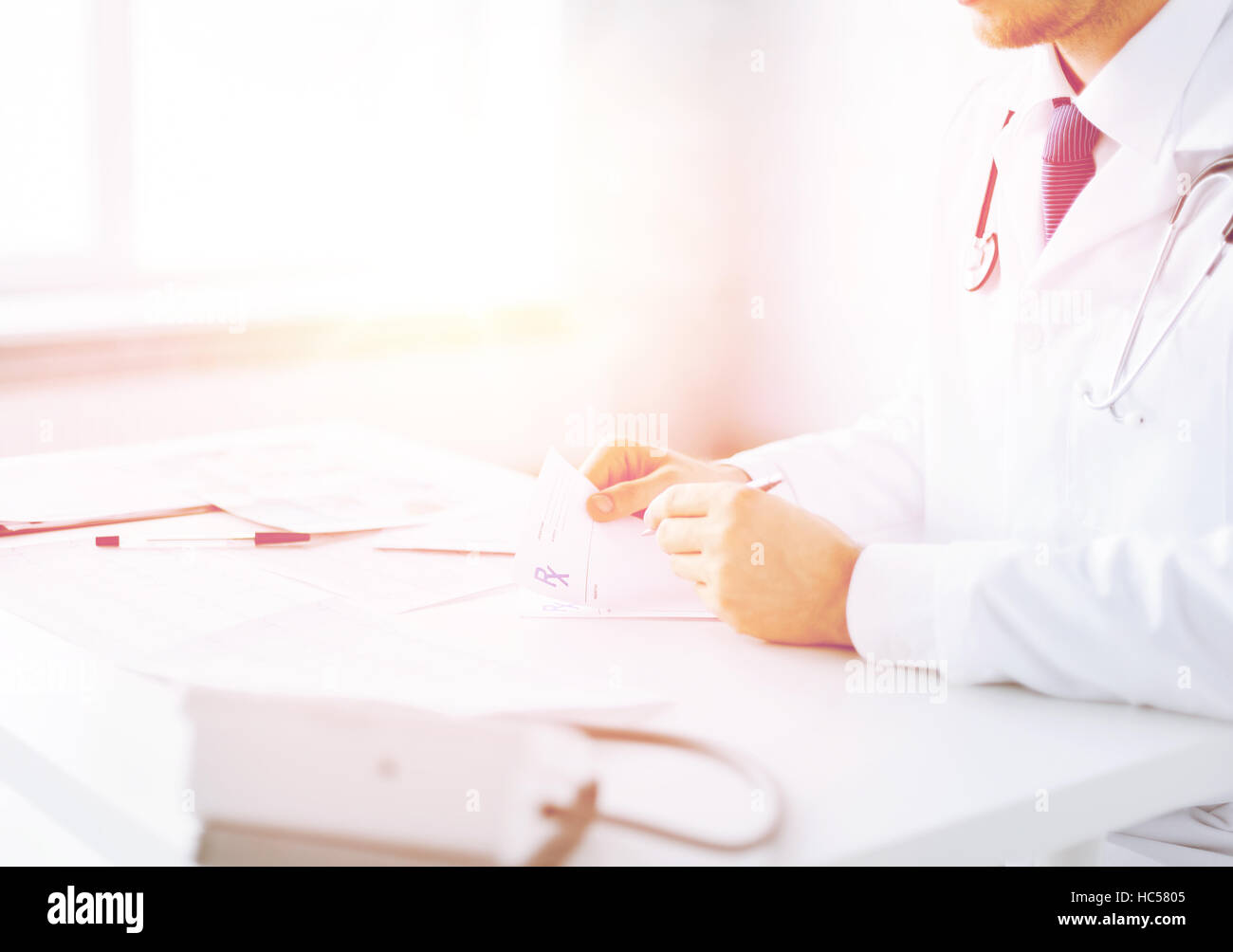 male doctor writing prescription paper Stock Photo - Alamy
