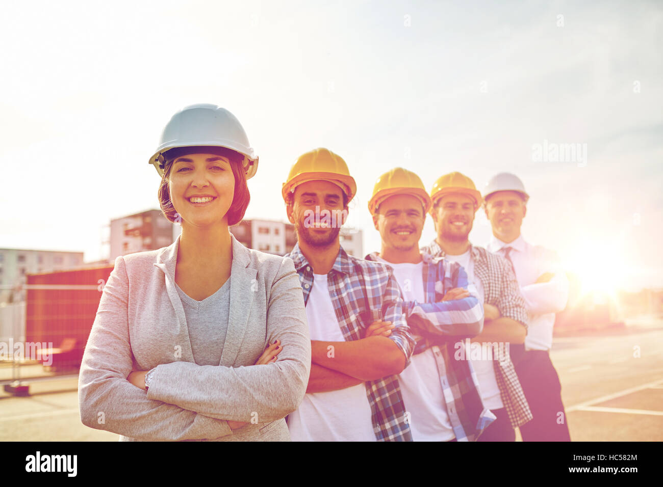 happy builders and architect at construction site Stock Photo - Alamy