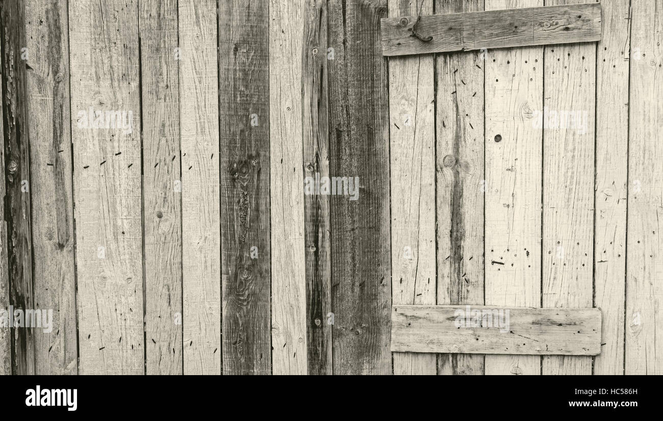Scraped wooden door in urban building, construction Stock Photo - Alamy