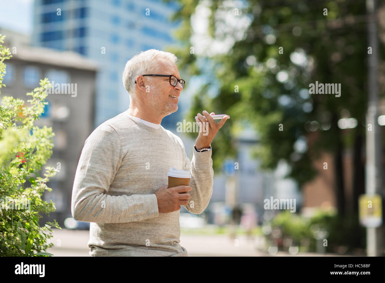 old man using voice command recorder on smartphone Stock Photo - Alamy