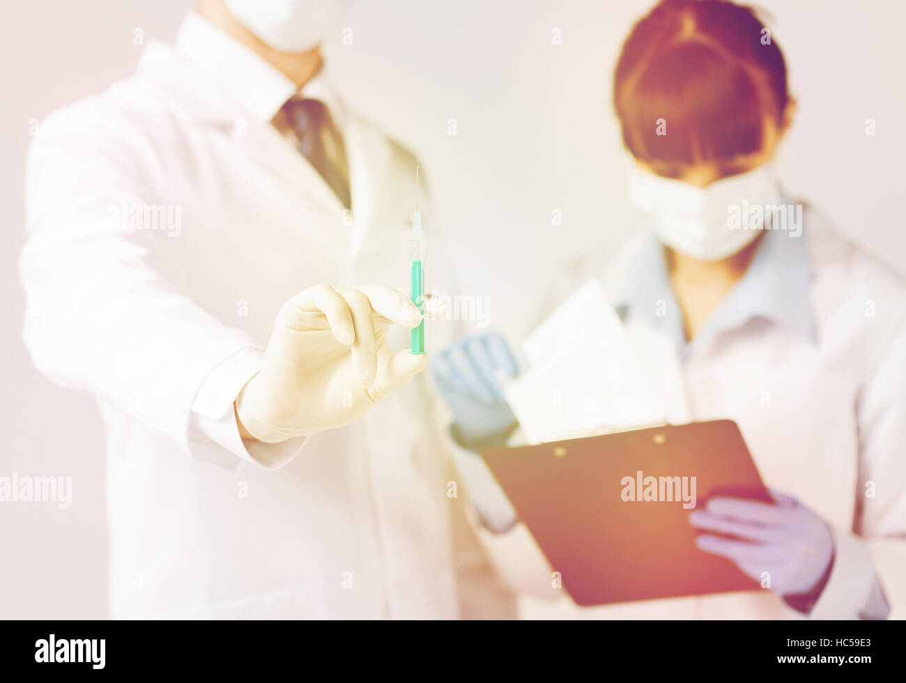 doctors with syringe Stock Photo - Alamy