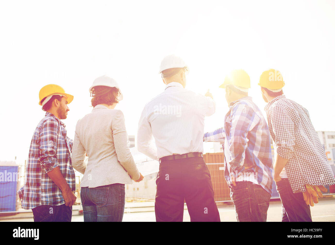 group of builders and architects at building site Stock Photo - Alamy