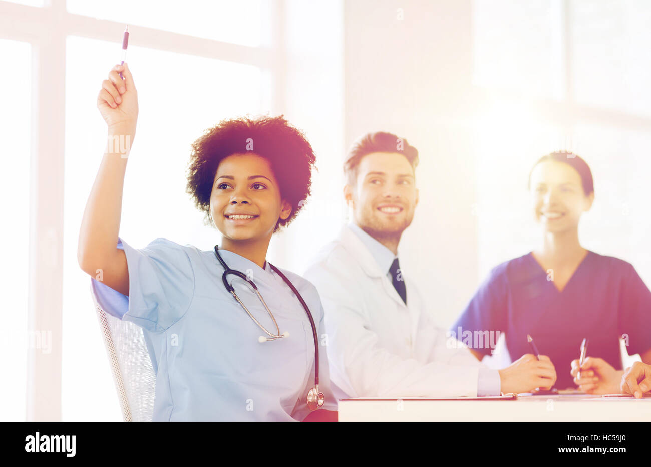 group of happy doctors on conference at hospital Stock Photo - Alamy
