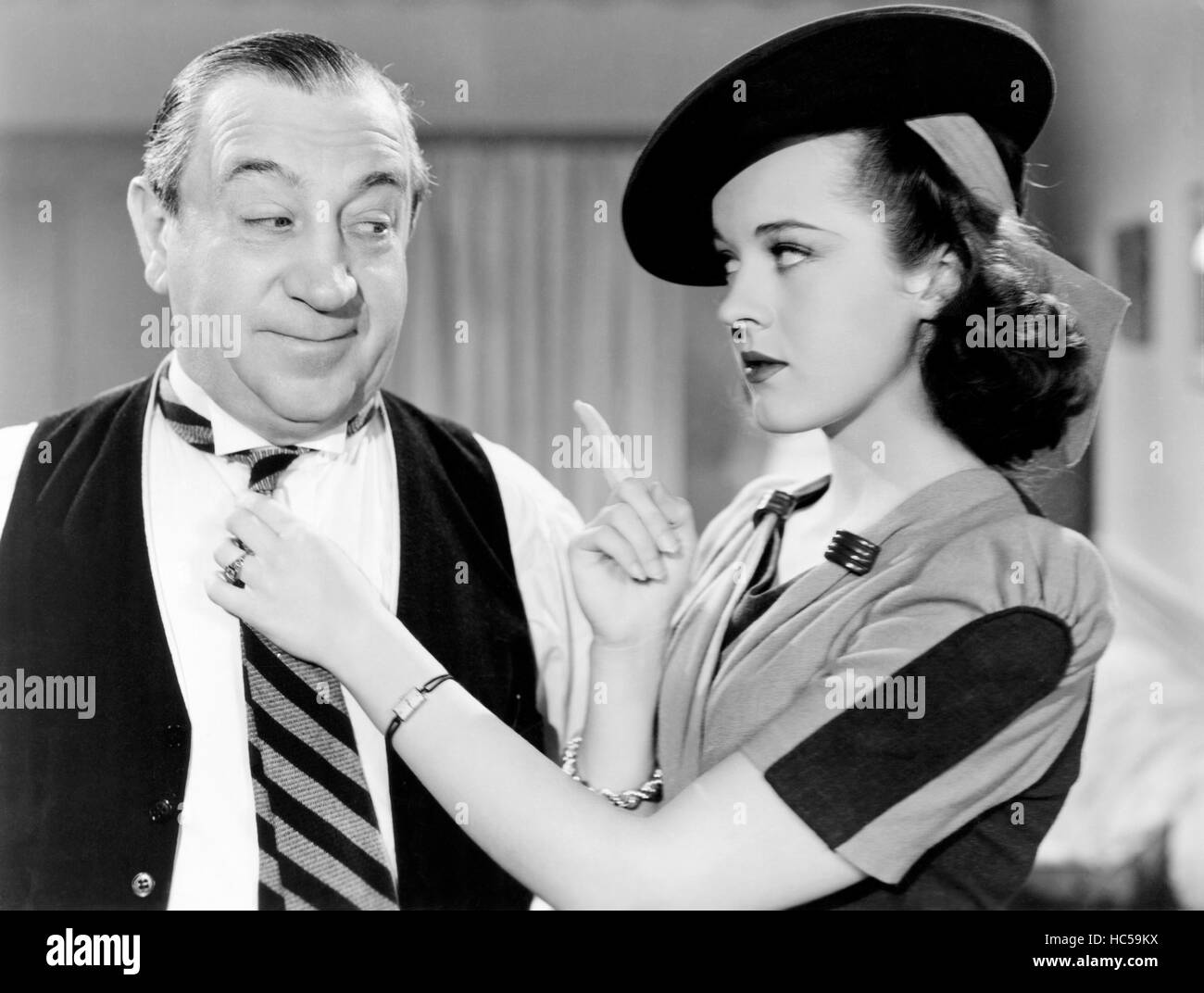 SLIGHTLY TEMPTED, from left, Hugh Herbert, Peggy Moran, 1940 Stock Photo - Alamy