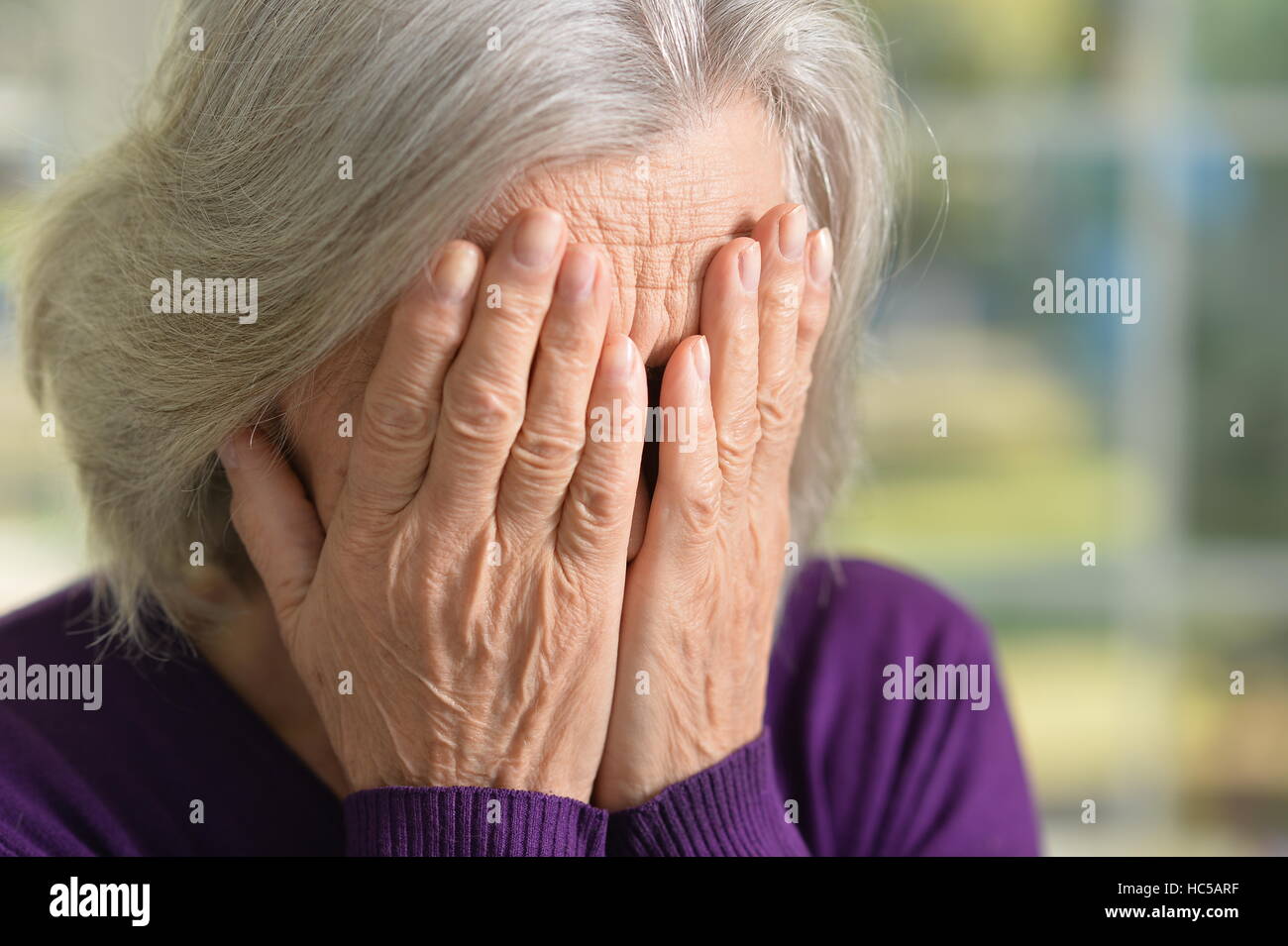 Stressed senior woman Stock Photo - Alamy