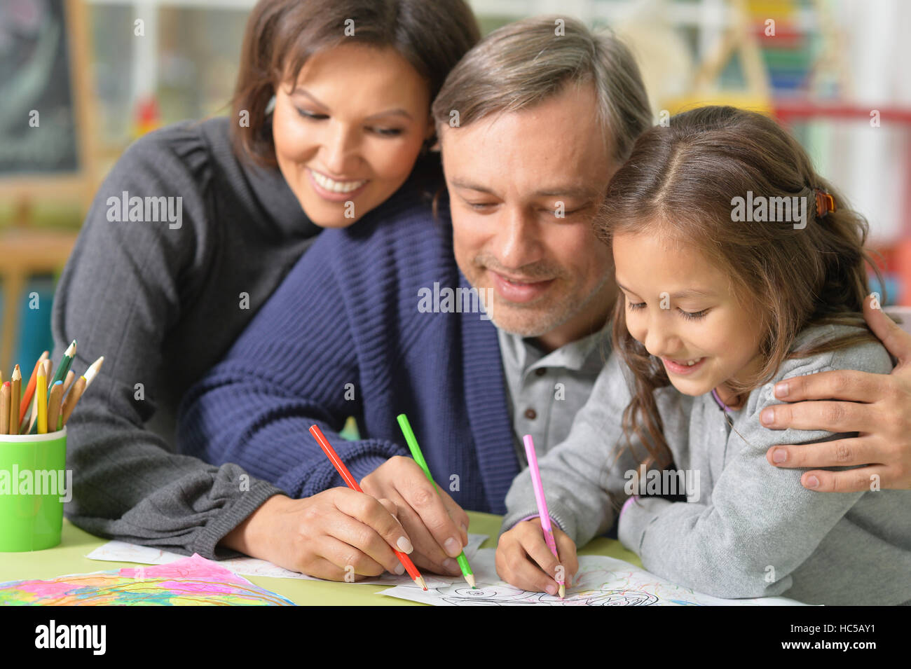 Family drawing together Stock Photo - Alamy