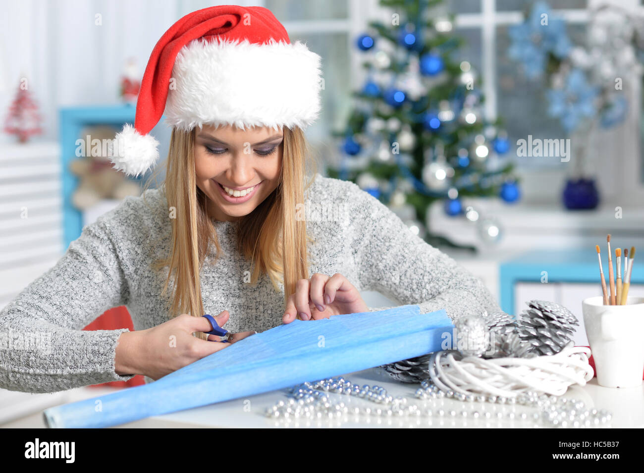 Woman cutting paper Stock Photo - Alamy