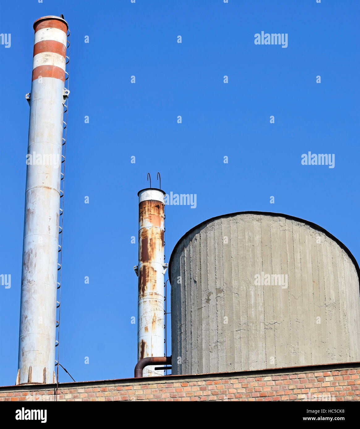 Smoke stacks of a factory Stock Photo - Alamy