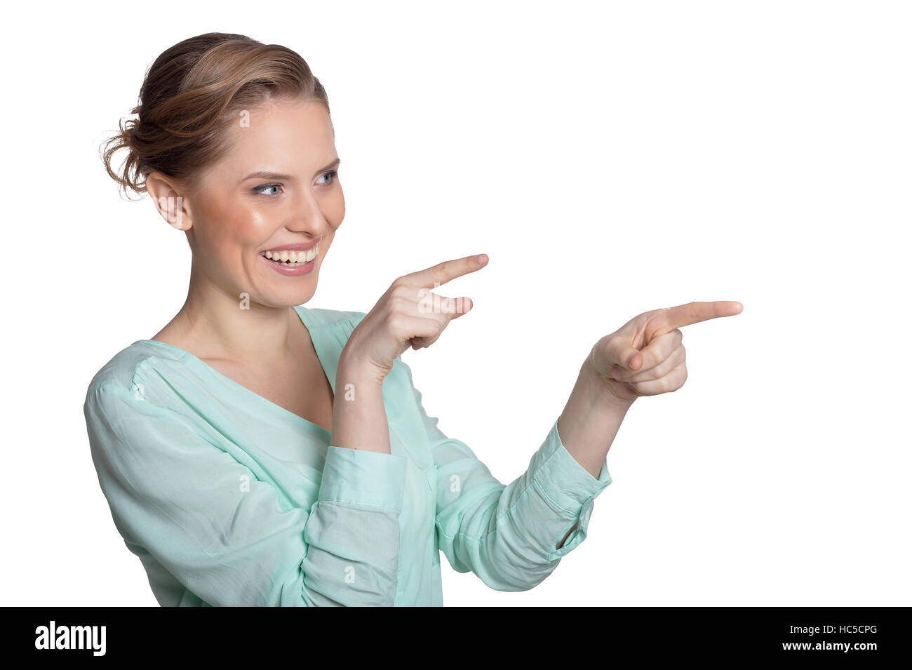 Young woman pointing Stock Photo - Alamy