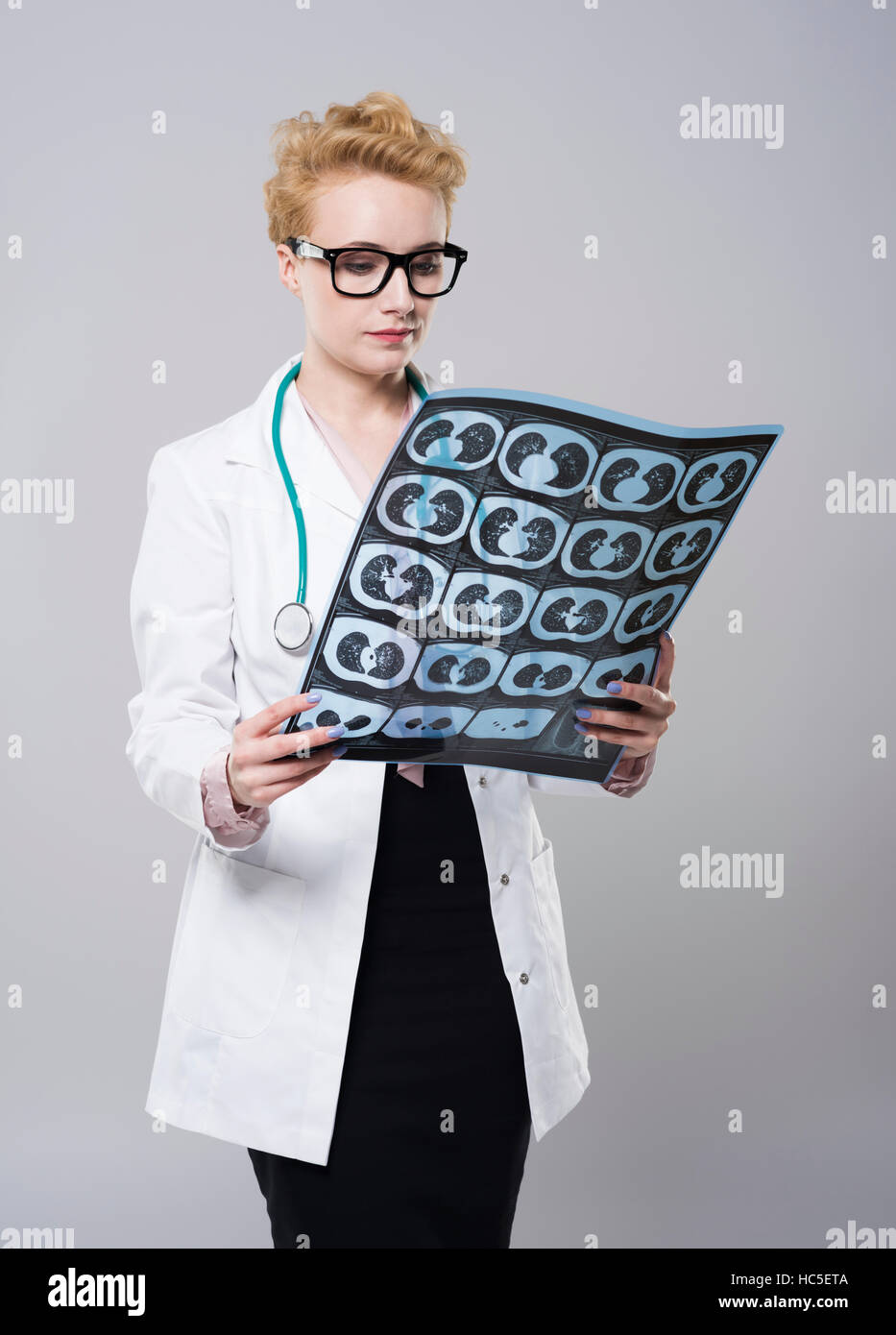 Doctor looking at x ray image Stock Photo - Alamy