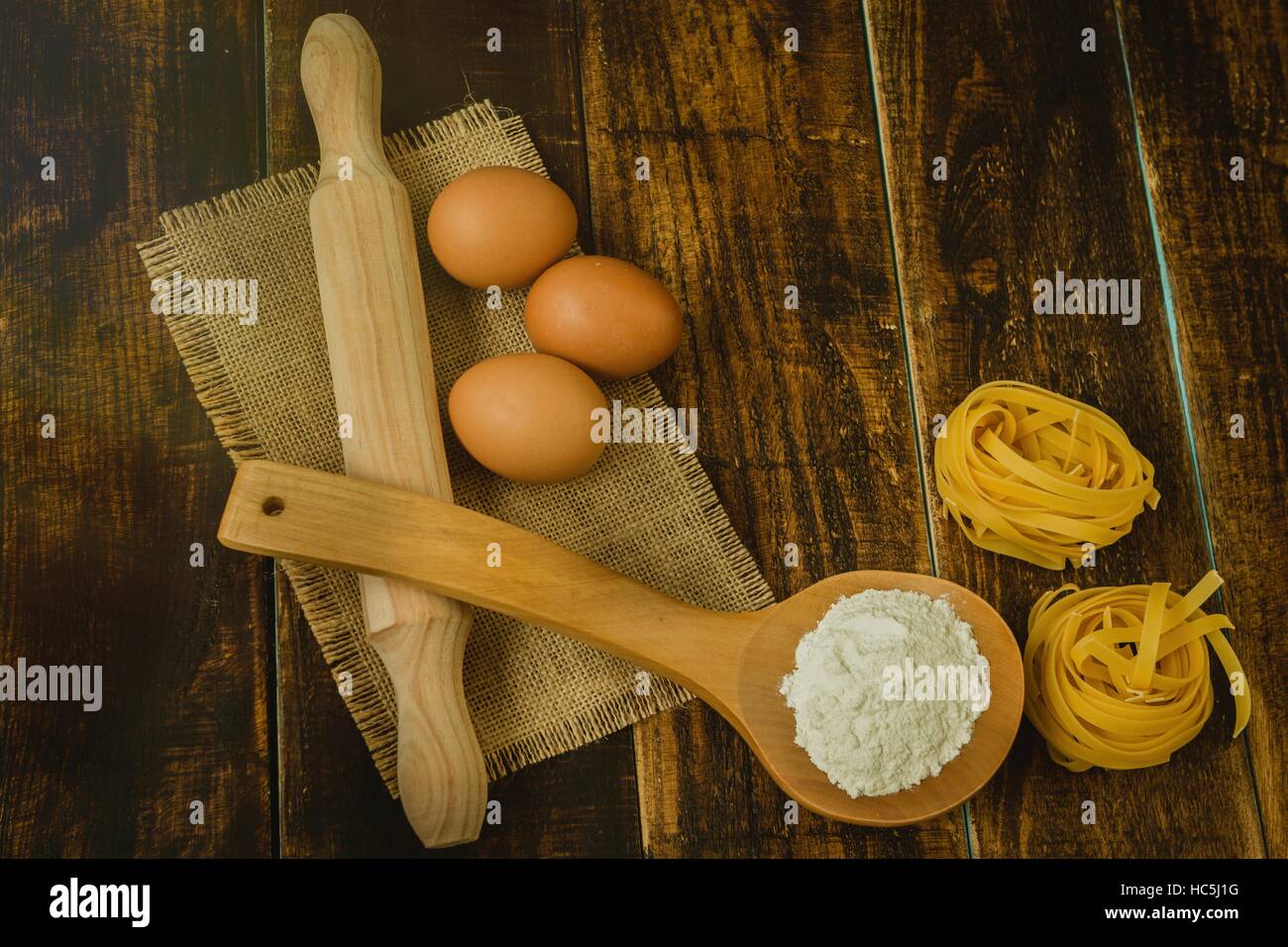 Ingredients for cooking pasta on rustic wood Stock Photo - Alamy