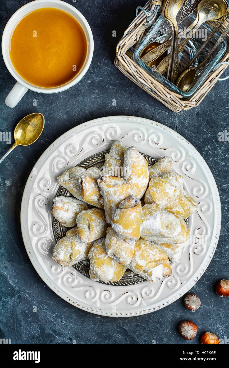 Homemade pastry stuffed with nuts in blue background Stock Photo - Alamy