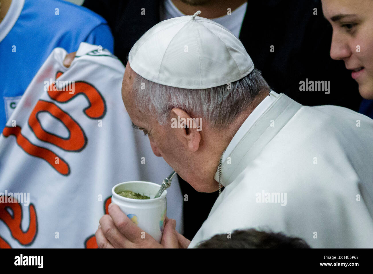 Pope Francis drinks a cup of mate as he leaves at the end of his Weekly ...