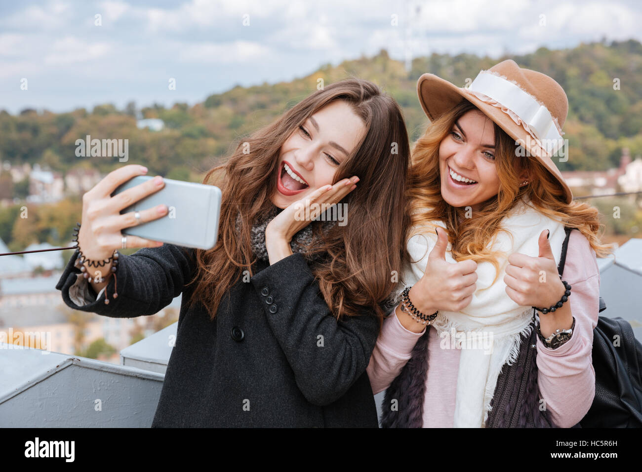 Beauty girls make a selfie. so funny models Stock Photo - Alamy