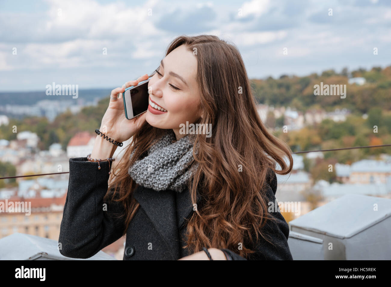 Pretty model talking at phone. smiling girl Stock Photo - Alamy