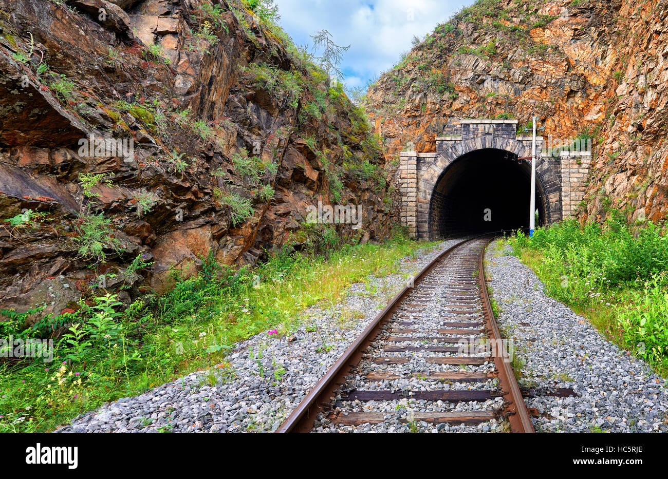 Railway recess before entering tunnel. Single track railway line ...