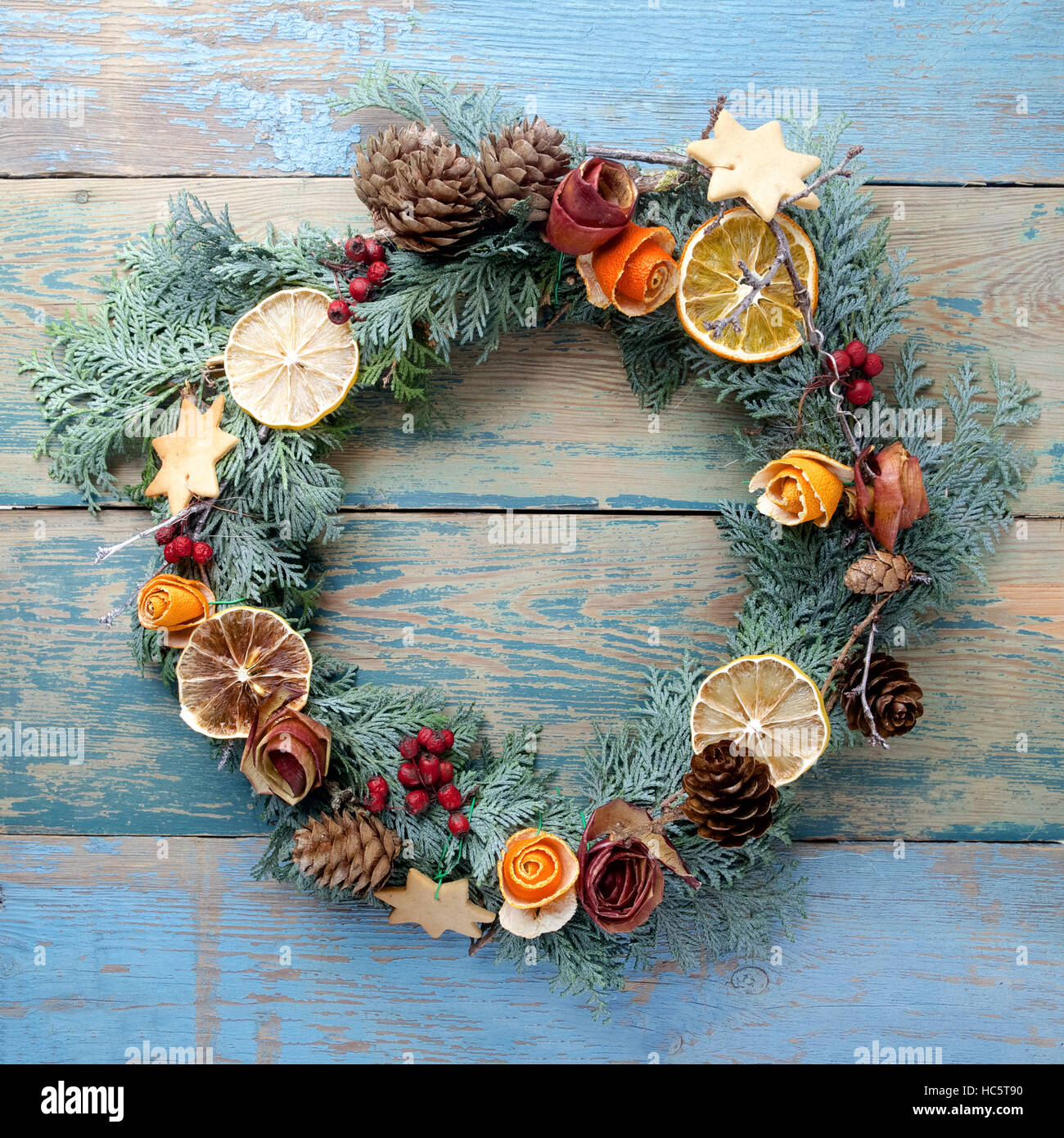 Advent wreath of twigs with four burning red candles and various ...