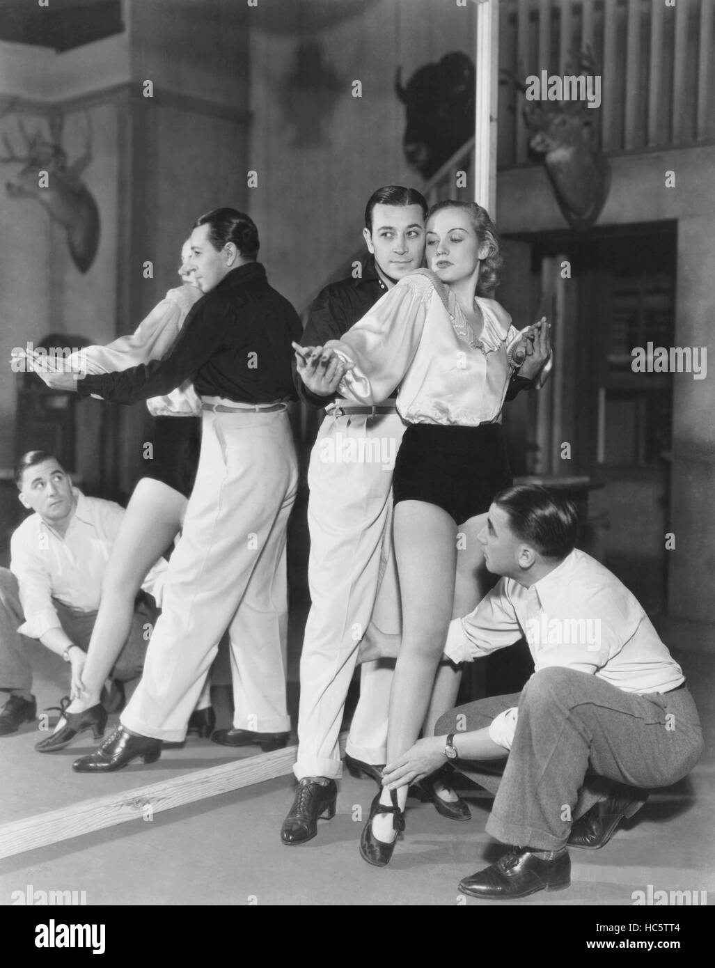 RUMBA, standing from left: George Raft, Carole Lombard on set, 1935 ...