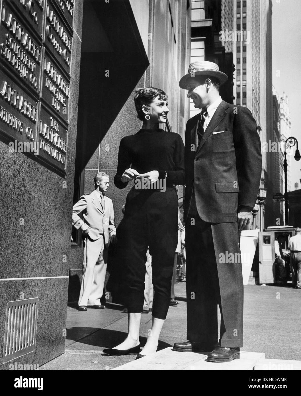 SABRINA, Audrey Hepburn, William Holden on location in the financial district of New York city ...