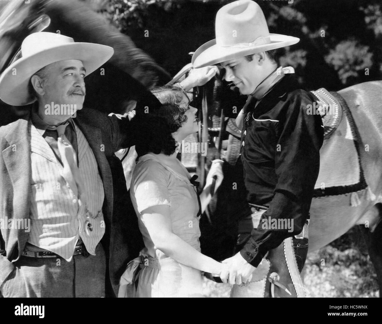 SADDLE BUSTER, from left: Richard Carlyle, Helen Foster, Tom Keene ...