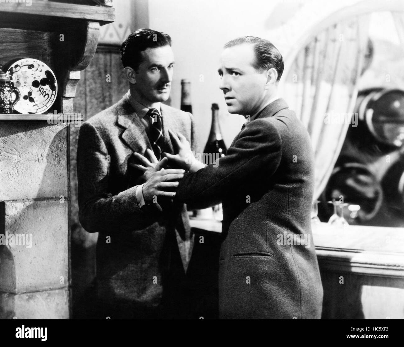 THE SAINT'S VACATION, from left, Hugh Sinclair, Cecil Parker, 1941 ...